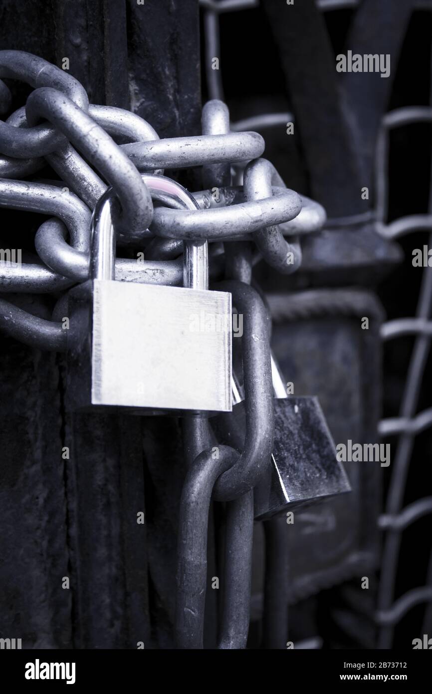 Closed door with chains and padlock Stock Photo - Alamy