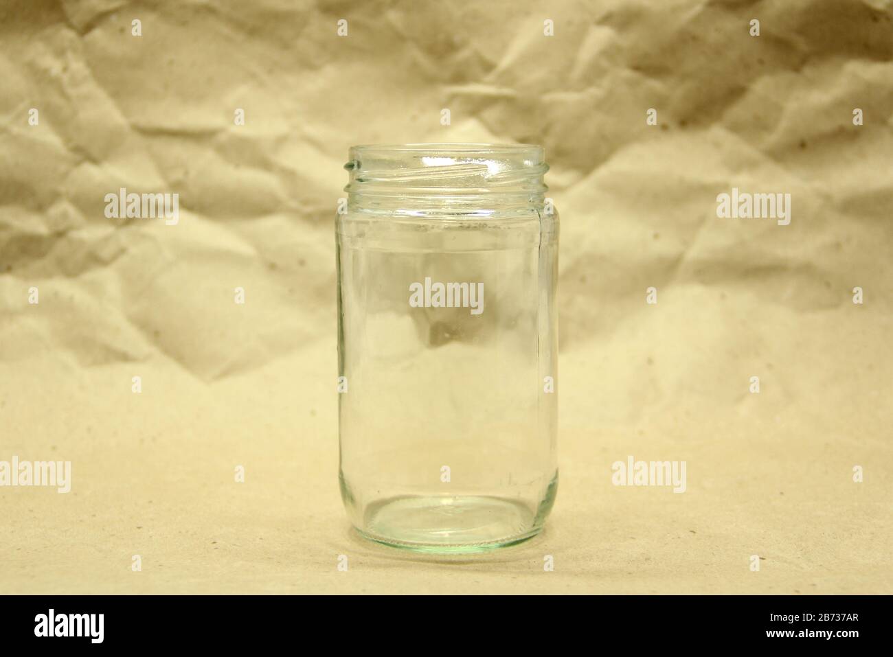 Glass empty bottle on craft paper background. Stock photo with empty ...