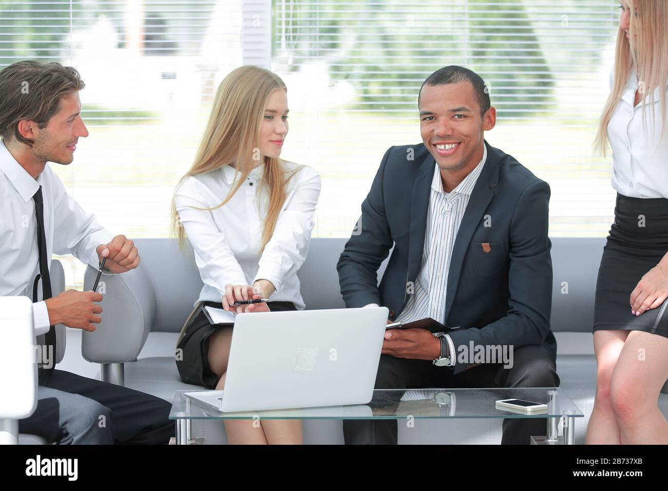 concentrated business team at the workplace thinking about business ...