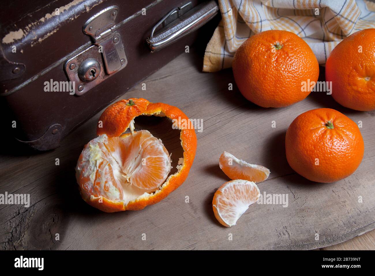 Several of unpeeled whole fresh orange mandarine or oranges, tangerines, clementines, citrus ...
