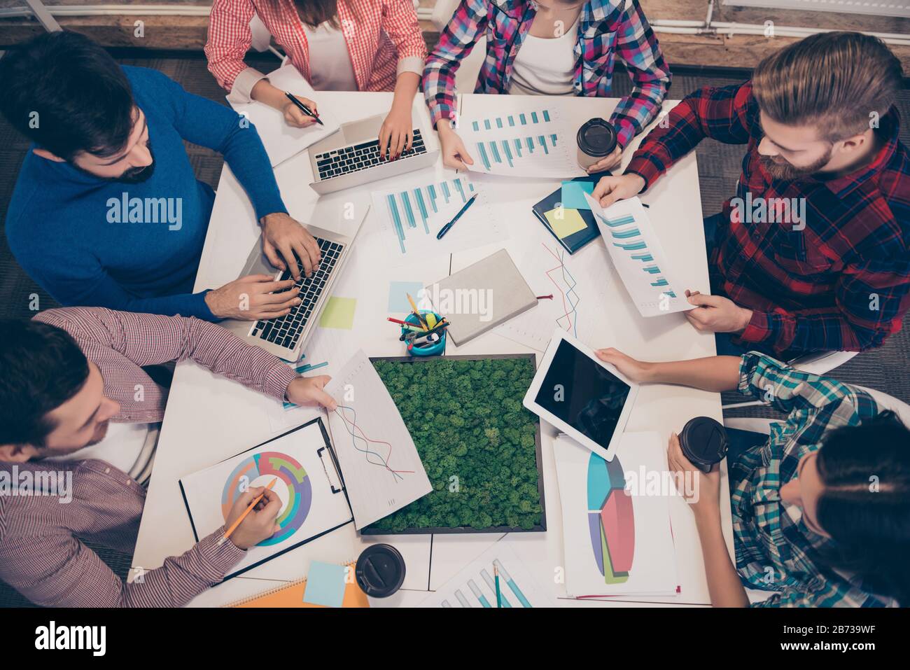Group of men working hard together hi-res stock photography and images ...