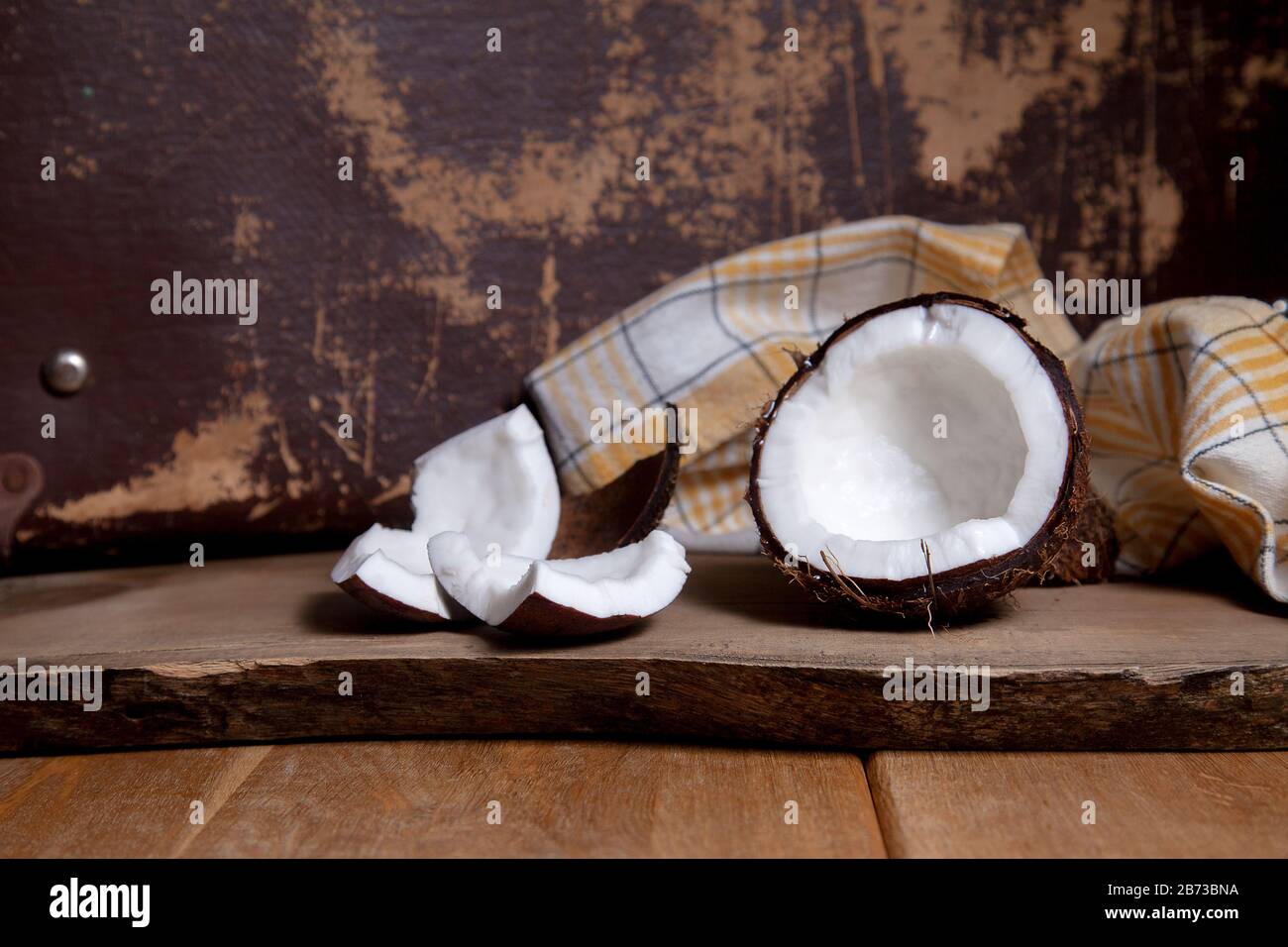 Coconut. Coconut shell, coconut flakes and small pieces of crashed nut ...