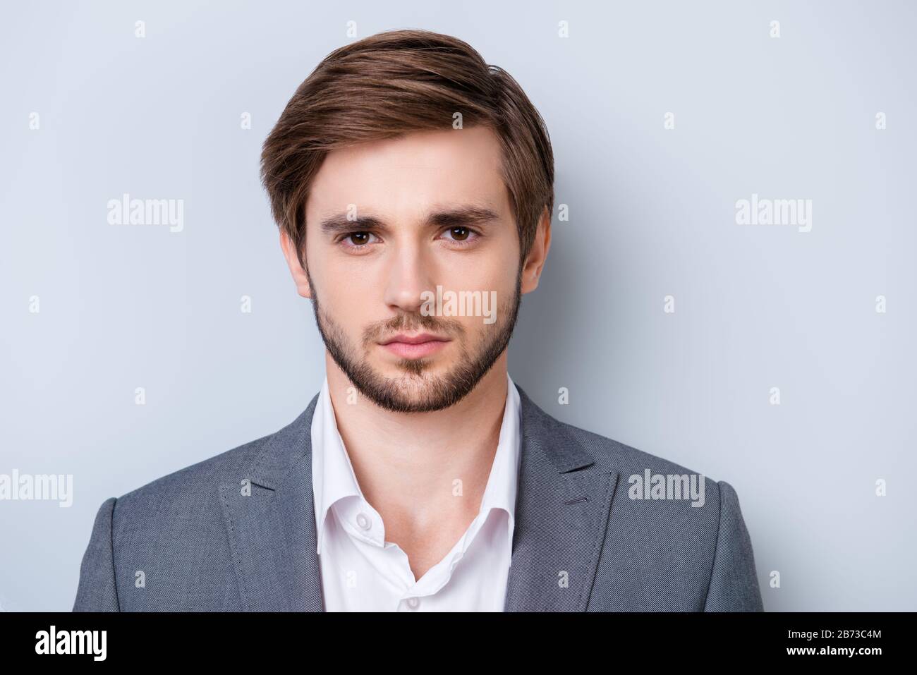 Close up portrait of successful handsome young man in formal wear make ...