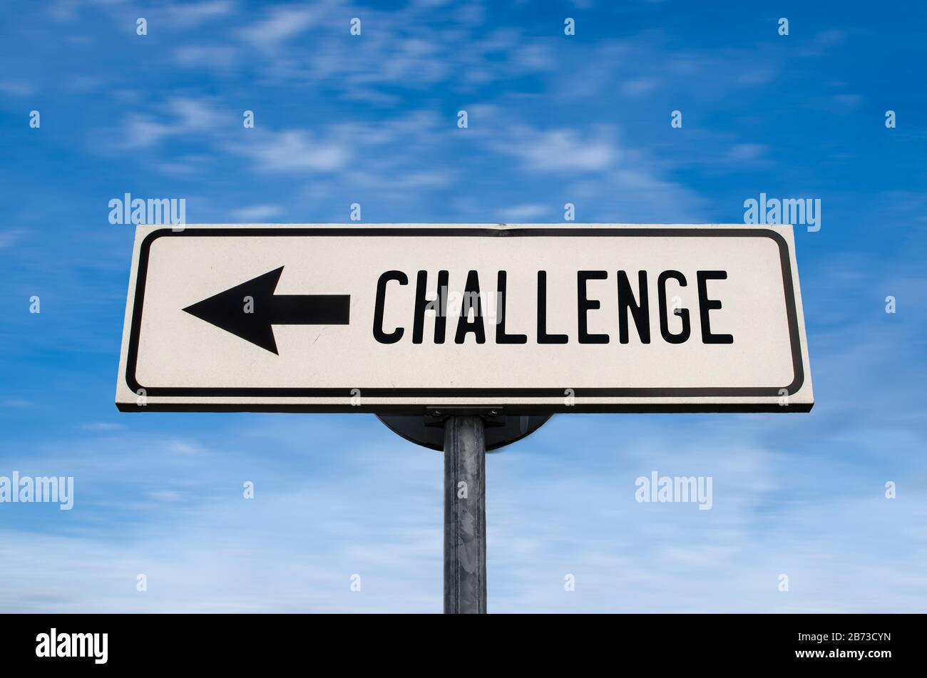 Challenge road sign, arrow on blue sky background. One way blank road ...