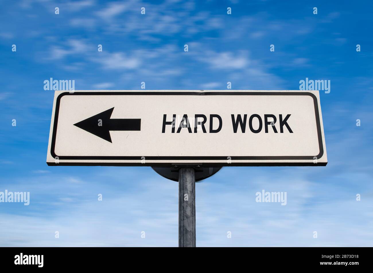 Hard work road sign, arrow on blue sky background. One way blank road ...