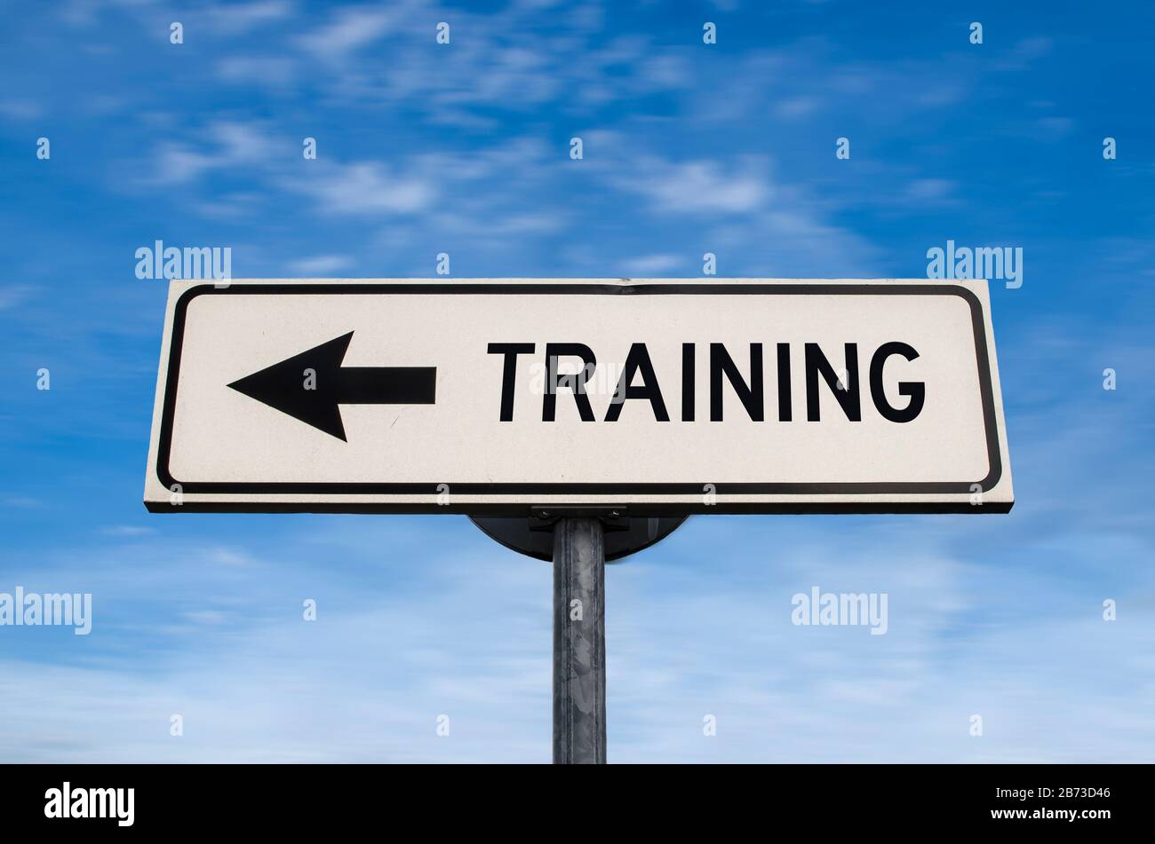 Training road sign, arrow on blue sky background. One way blank road ...