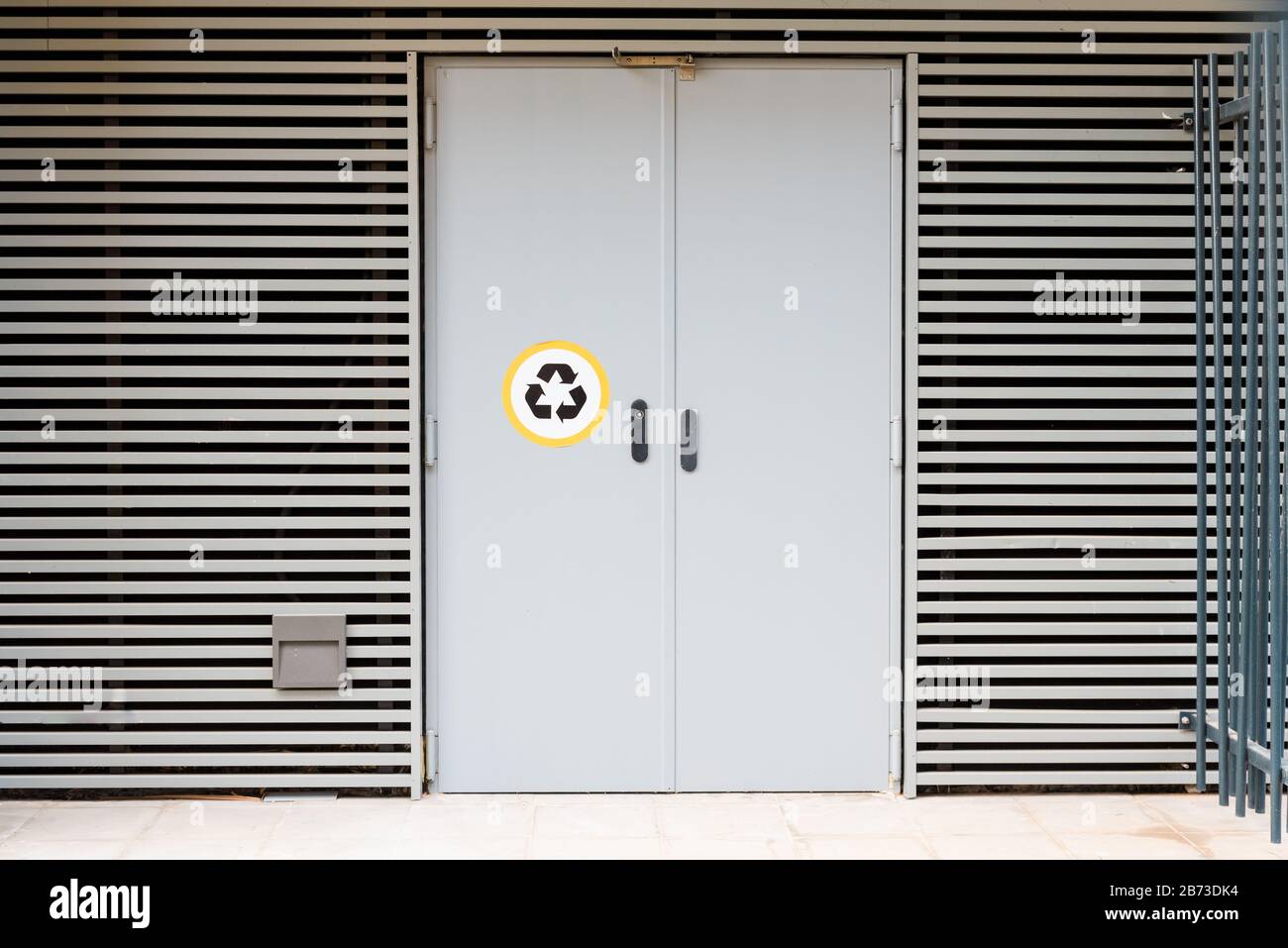 A door of a residential building to deposit recyclable garbage Stock ...