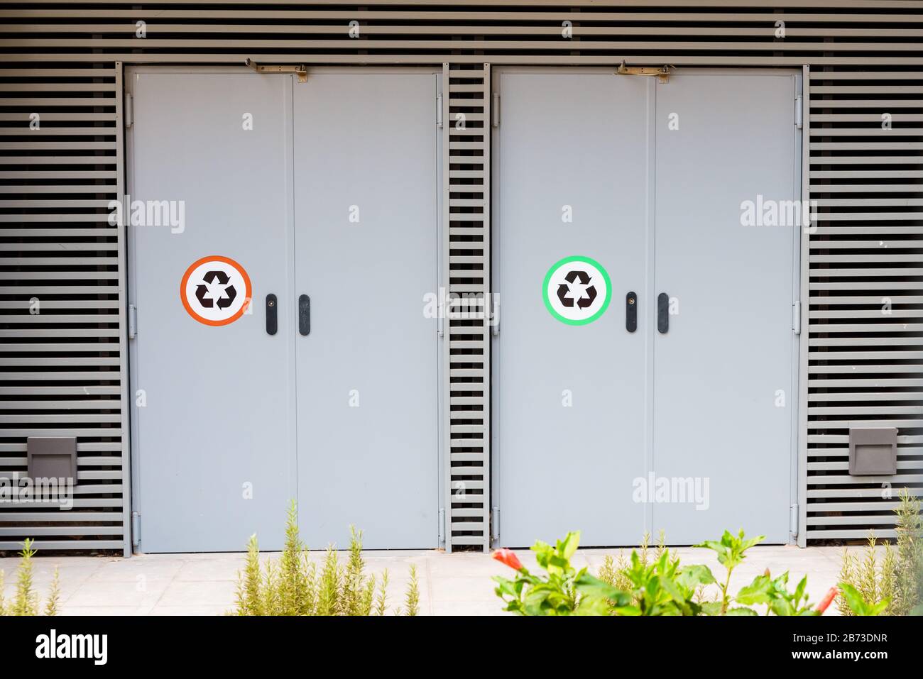 Two service doors to remove recyclable garbage from an office building ...