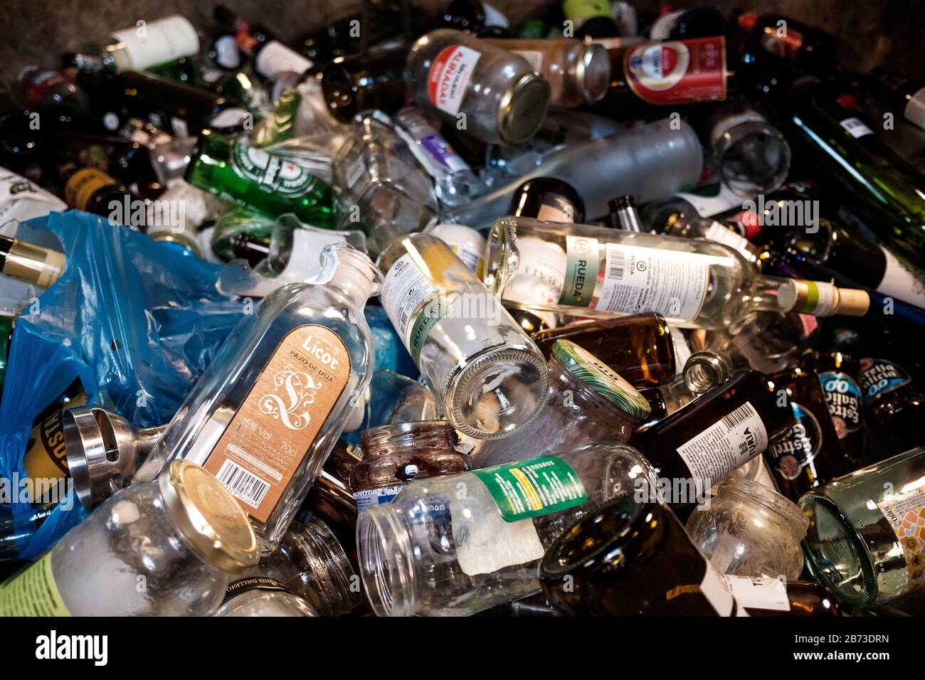 Valencia, Spain - March 3, 2020: Waste from a party, many glass bottles ...