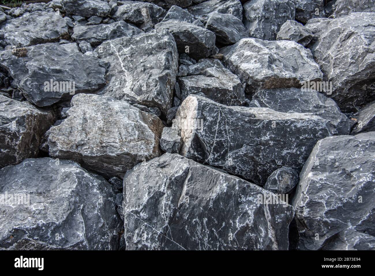 Quarrystones from natural wall on heaps Stock Photo - Alamy