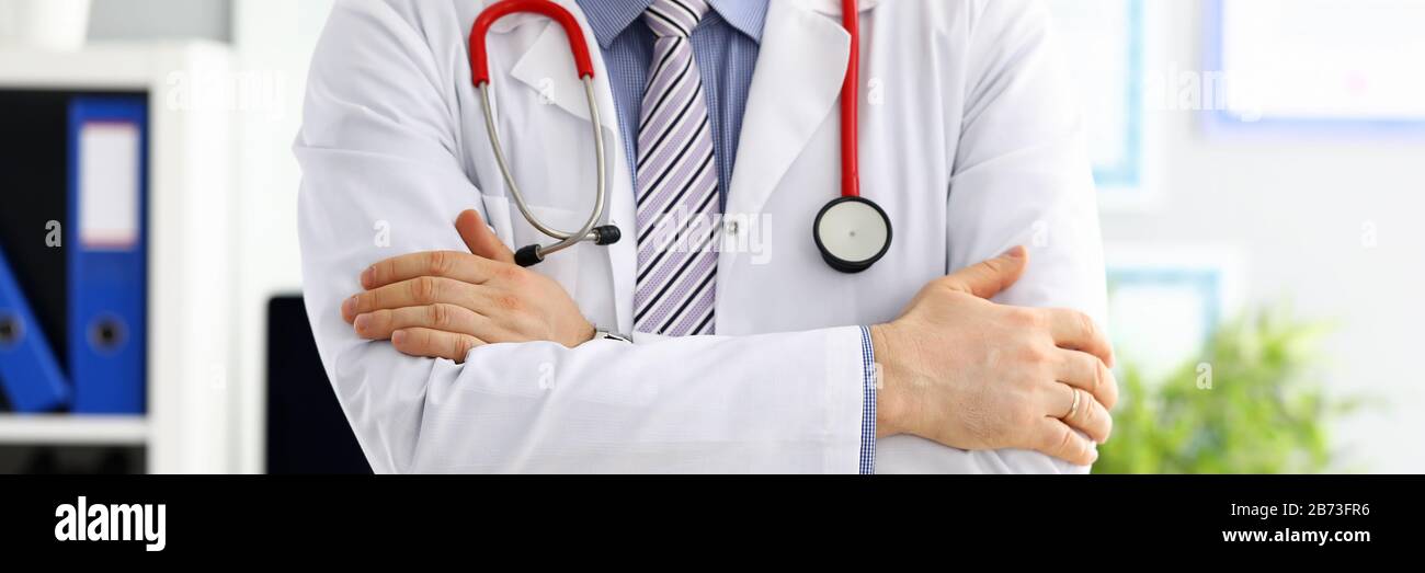Male medicine doctor hands crossed on his chest Stock Photo - Alamy