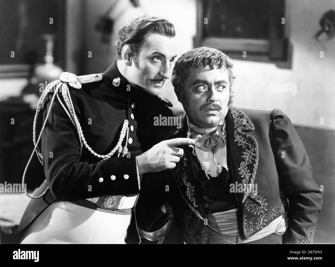 BASIL RATHBONE as Captain Esteban Pasquale and J. EDWARD BROMBERG as ...