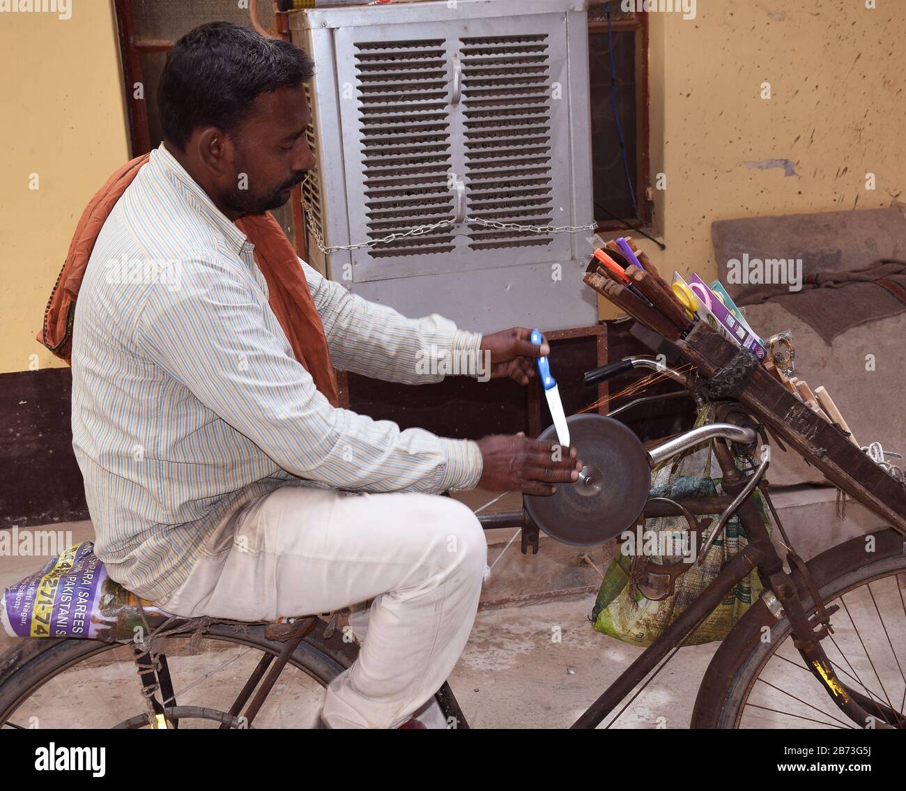 Vintage knife sharpening hi-res stock photography and images - Alamy