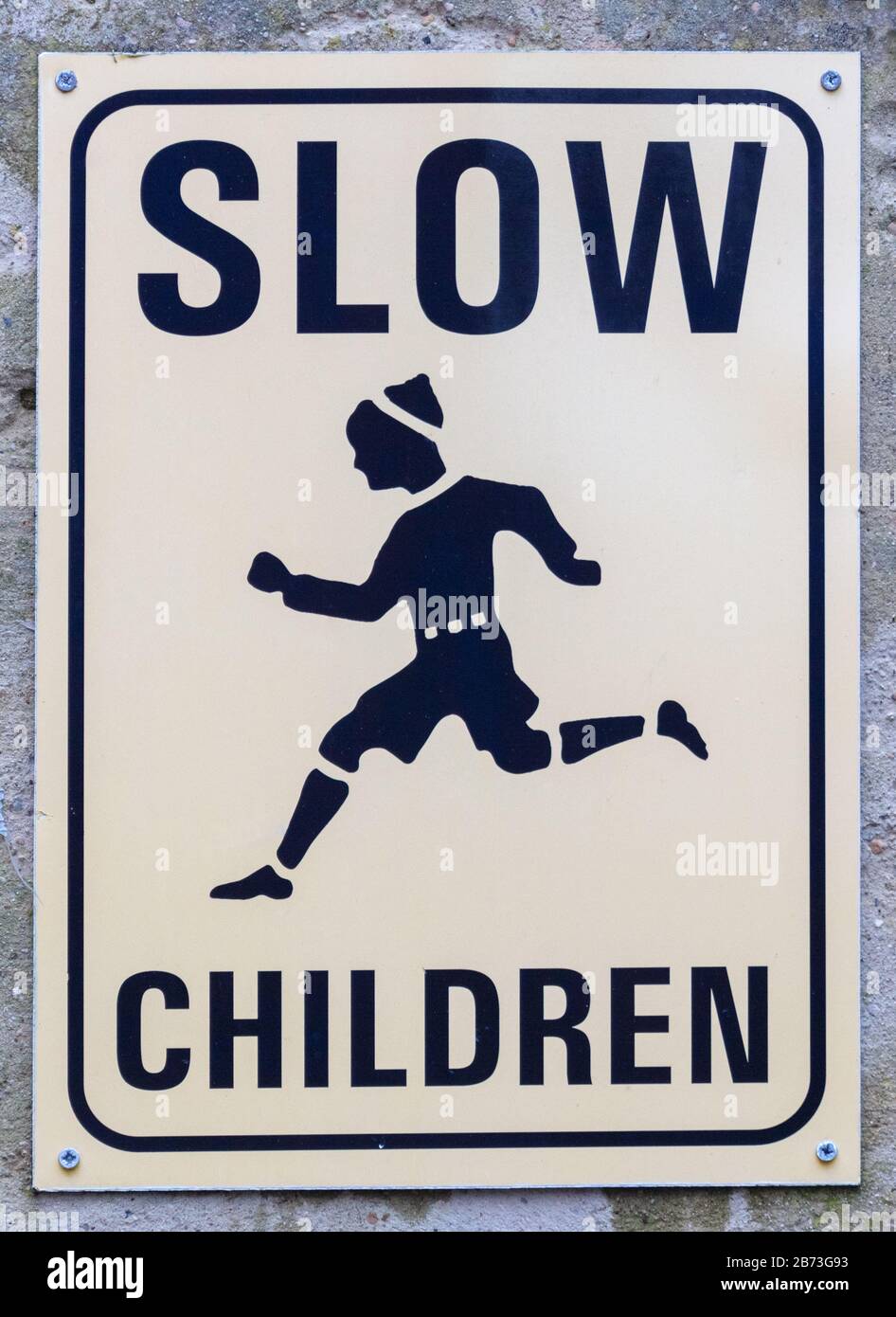 SLOW CHILDREN road warning sign Stock Photo - Alamy