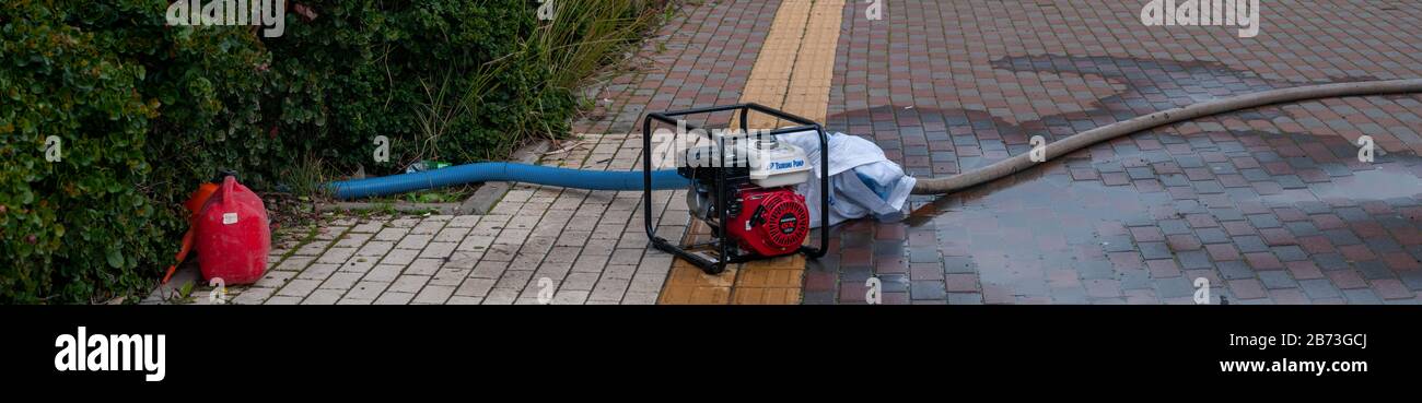 Gasoline operated Centrifugal engine-driven pump is pumping wastewater ...