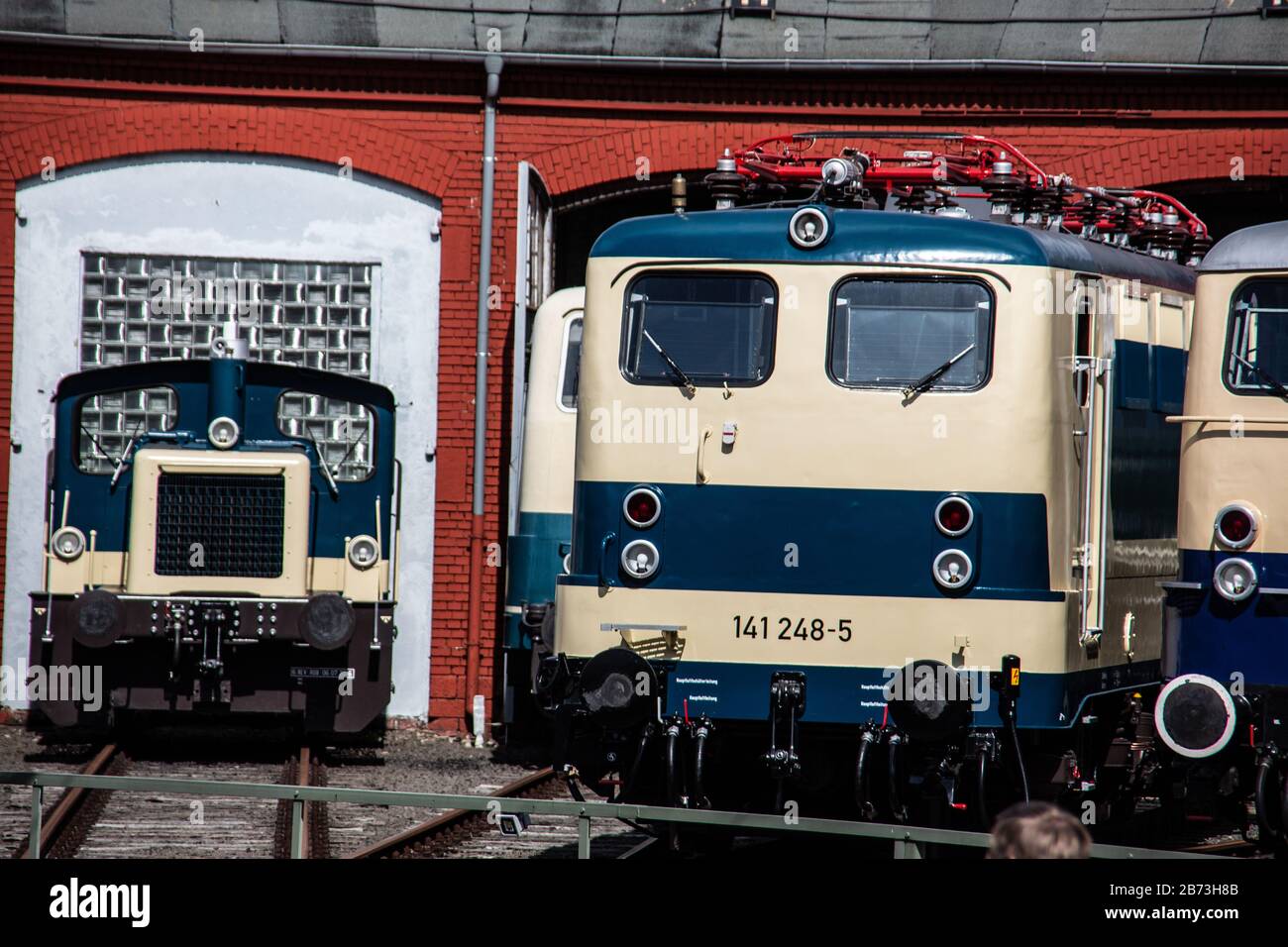 Locomotive shed with electric and diesel locomotives Stock Photo - Alamy