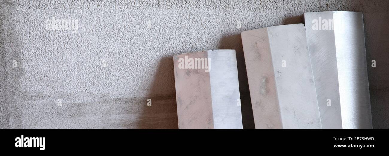 Set of finishing building tools standing at stucco wall Stock Photo - Alamy