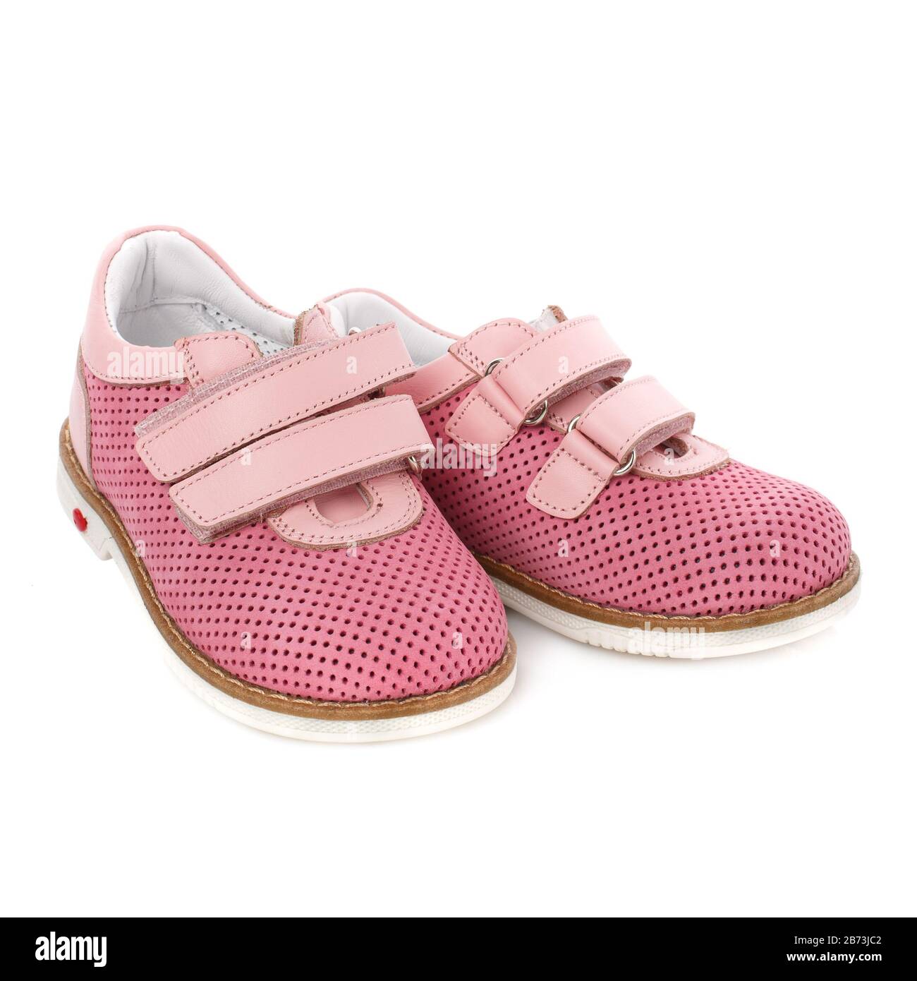 Children's pink shoes for girls isolated on white Stock Photo - Alamy