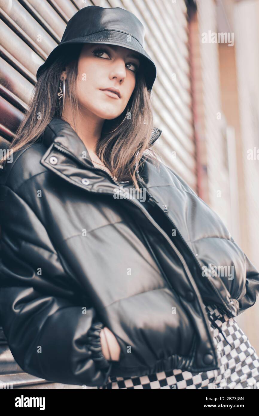 portrait of modern brunette girl on the street as a neighborhood ...