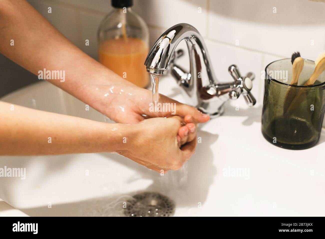 Washing hands under flowing water. Hands washing with proper technique ...