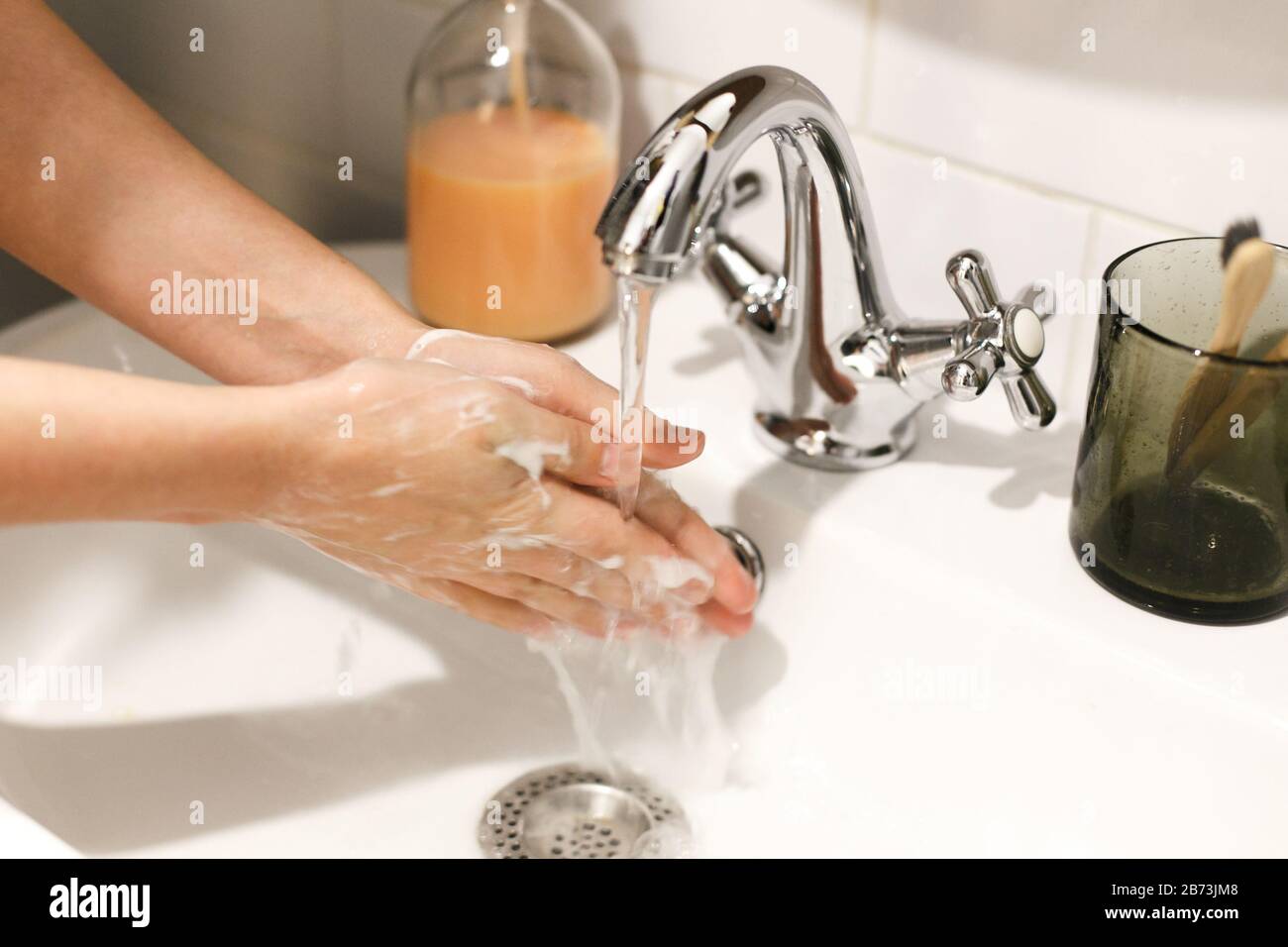 Washing hands. Hands washing under flowing water with proper technique ...