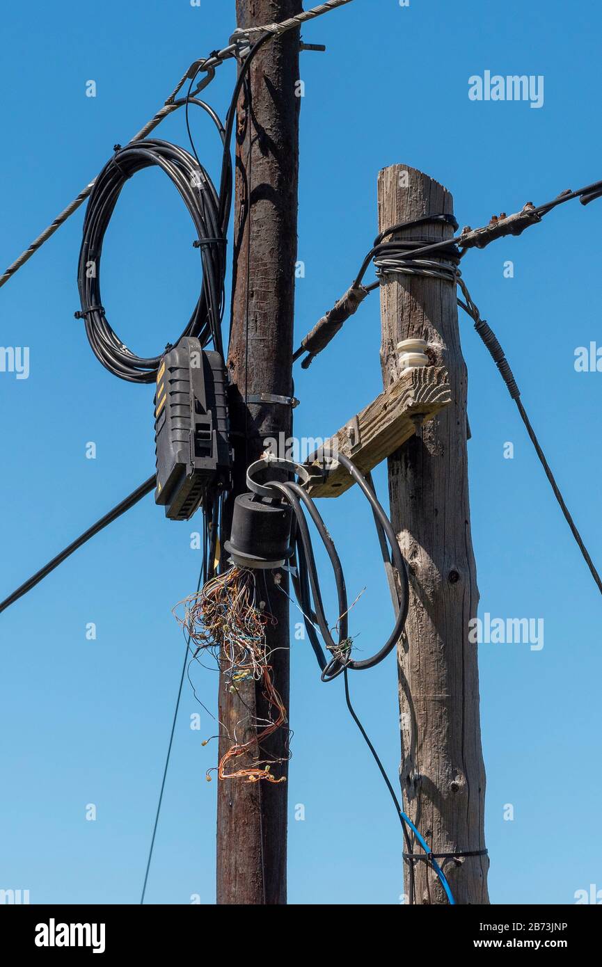 Telephone electrical wire wooden poles hi-res stock photography and ...