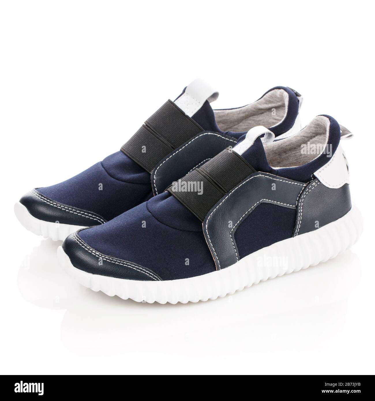 Dark blue shoes for boys isolated on white. Side view Stock Photo - Alamy