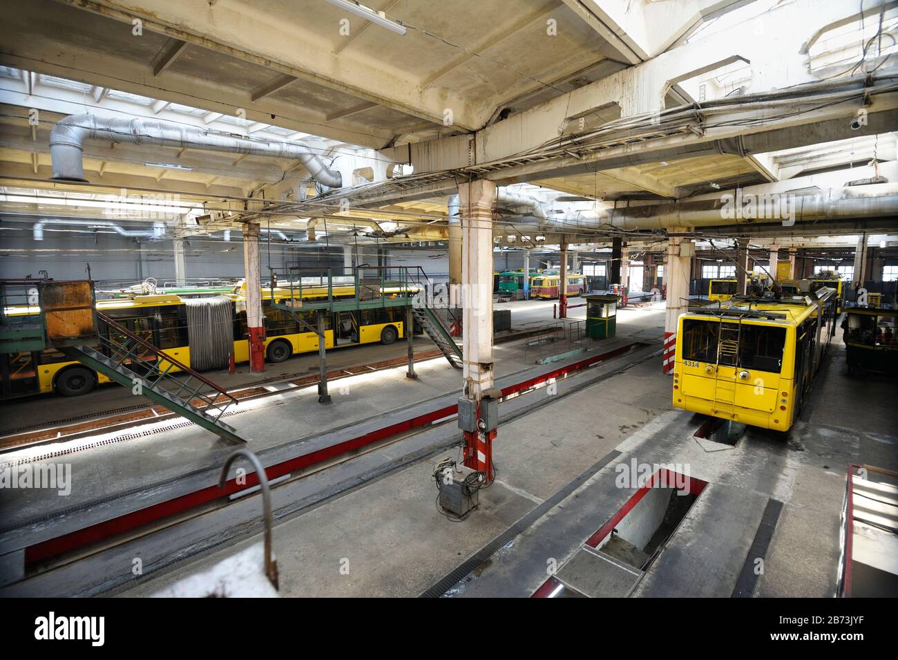 Trolleybuses parked at the trolley depot hangar for technical ...