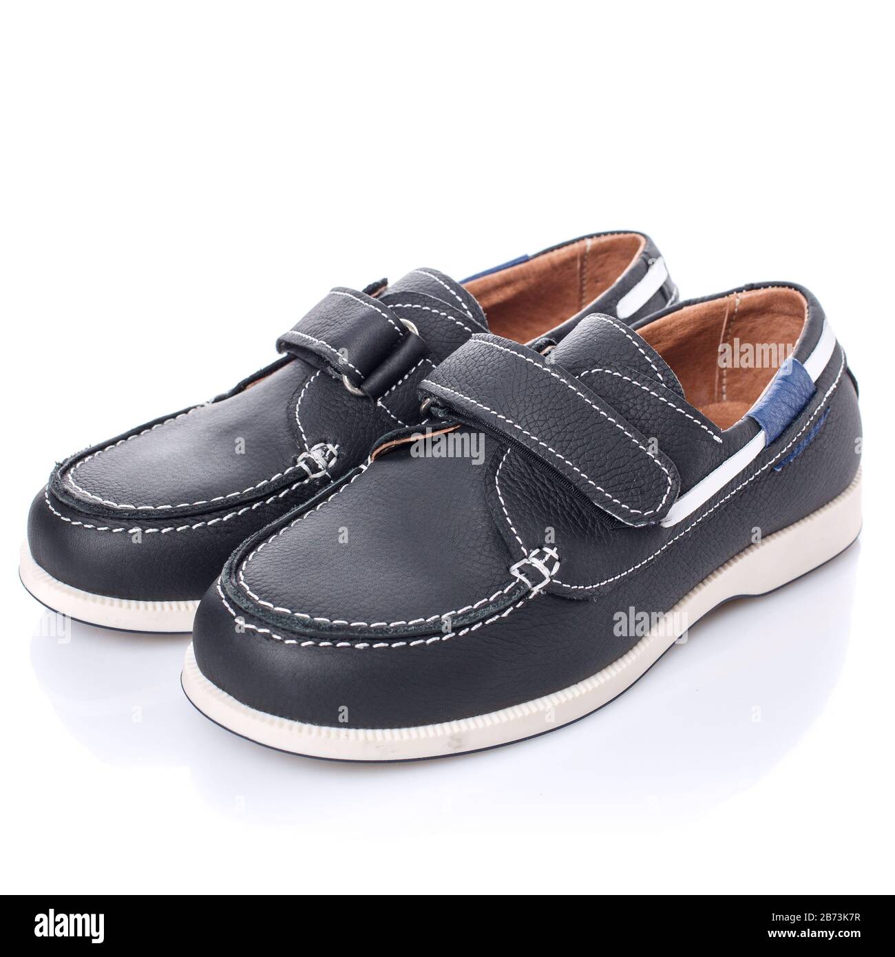 Children's black leather shoes for boys isolated on white. Side view ...