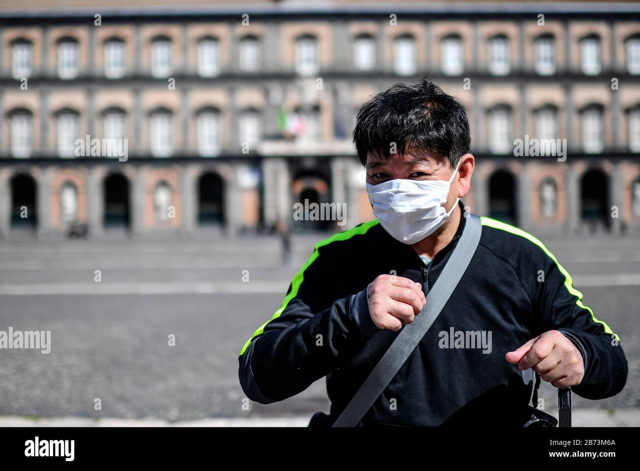 Naples, Italy. 13th Mar 2020. Tourist wearing an antivirus mask to ...