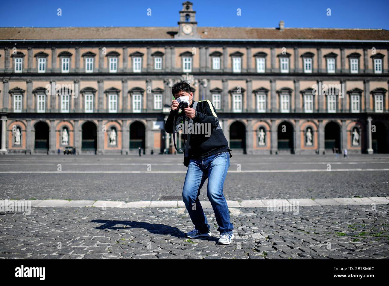 Naples, Italy. 13th Mar 2020. Tourist wearing an antivirus mask to ...