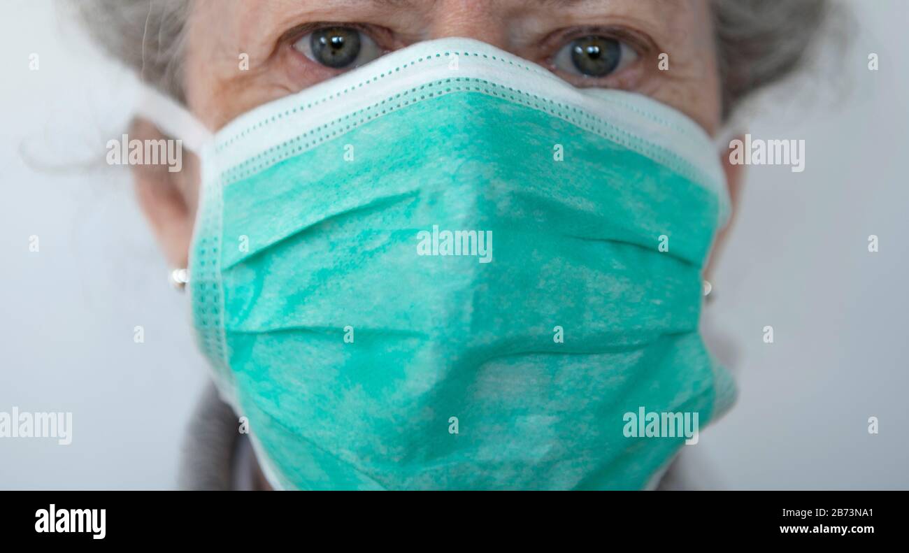 Older woman with face mask hi-res stock photography and images - Alamy