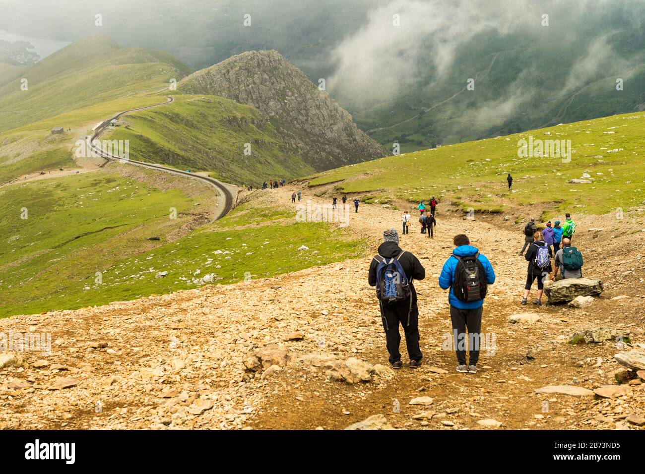 Walkers approaching Clogwyn Station on Snowdon Mountain Railway, as ...