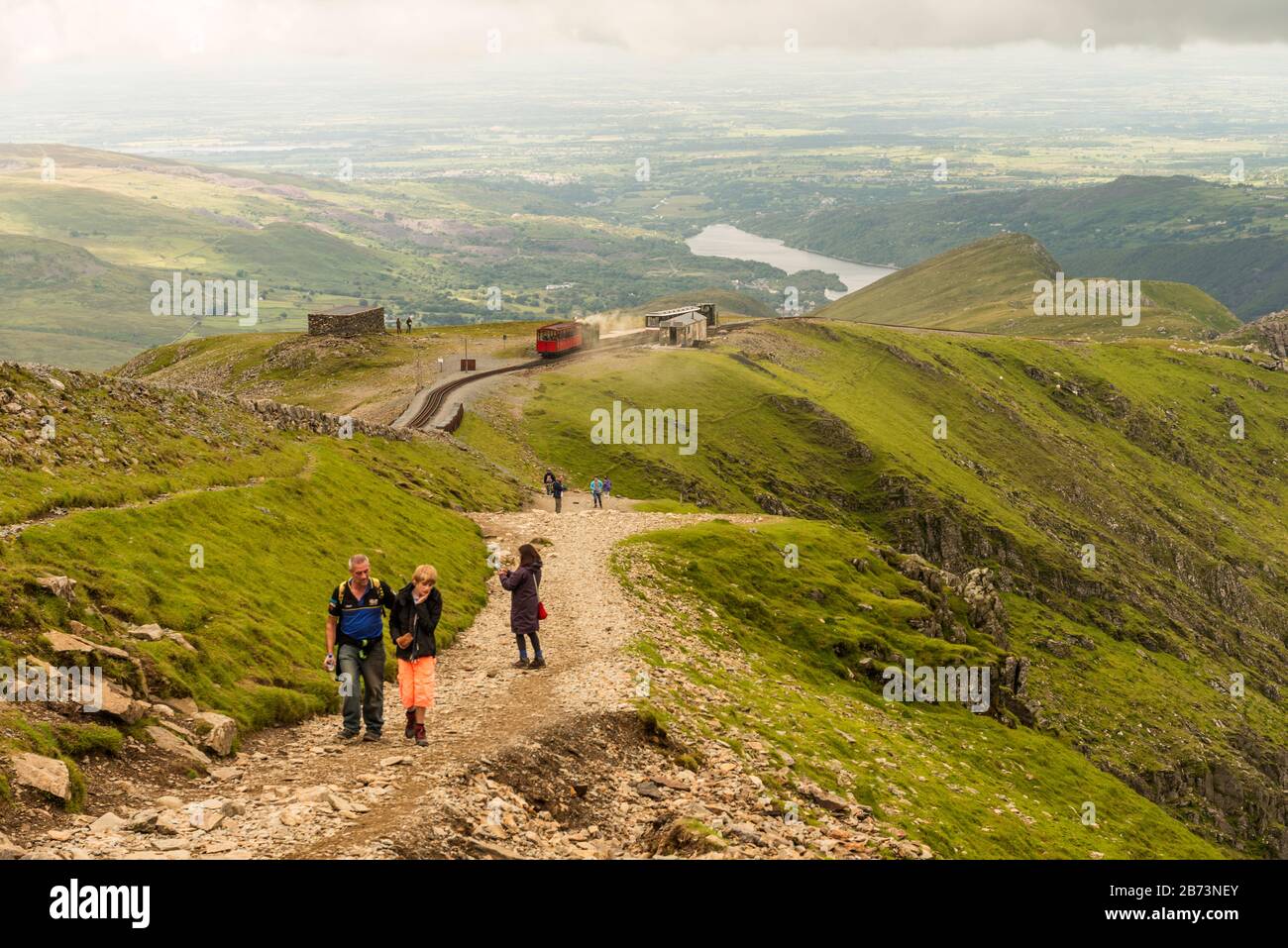 Walkers approaching Clogwyn Station on Snowdon Mountain Railway, as ...