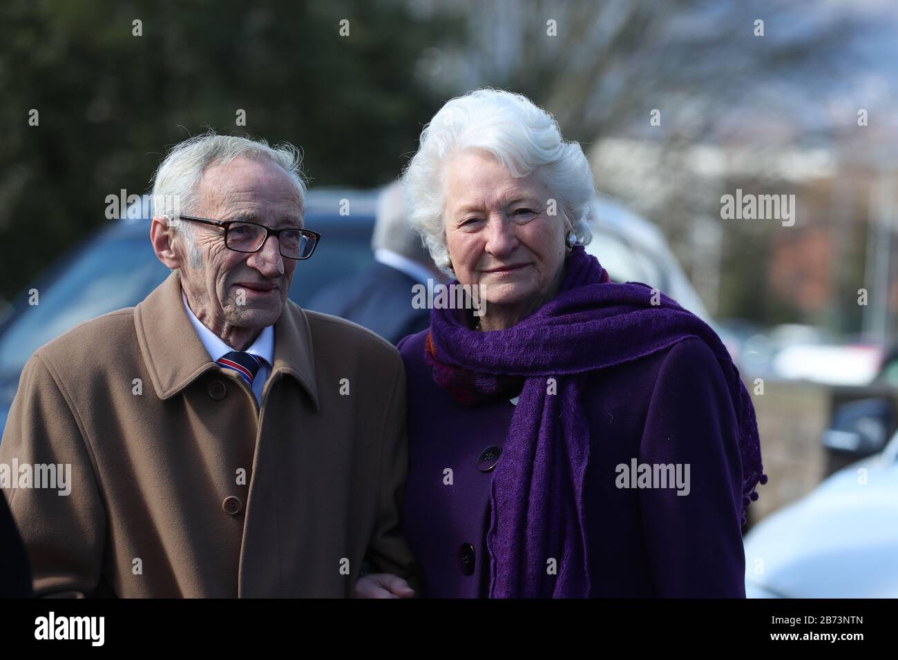 Dame Mary Peters (right) leaves the church following the funeral of ...