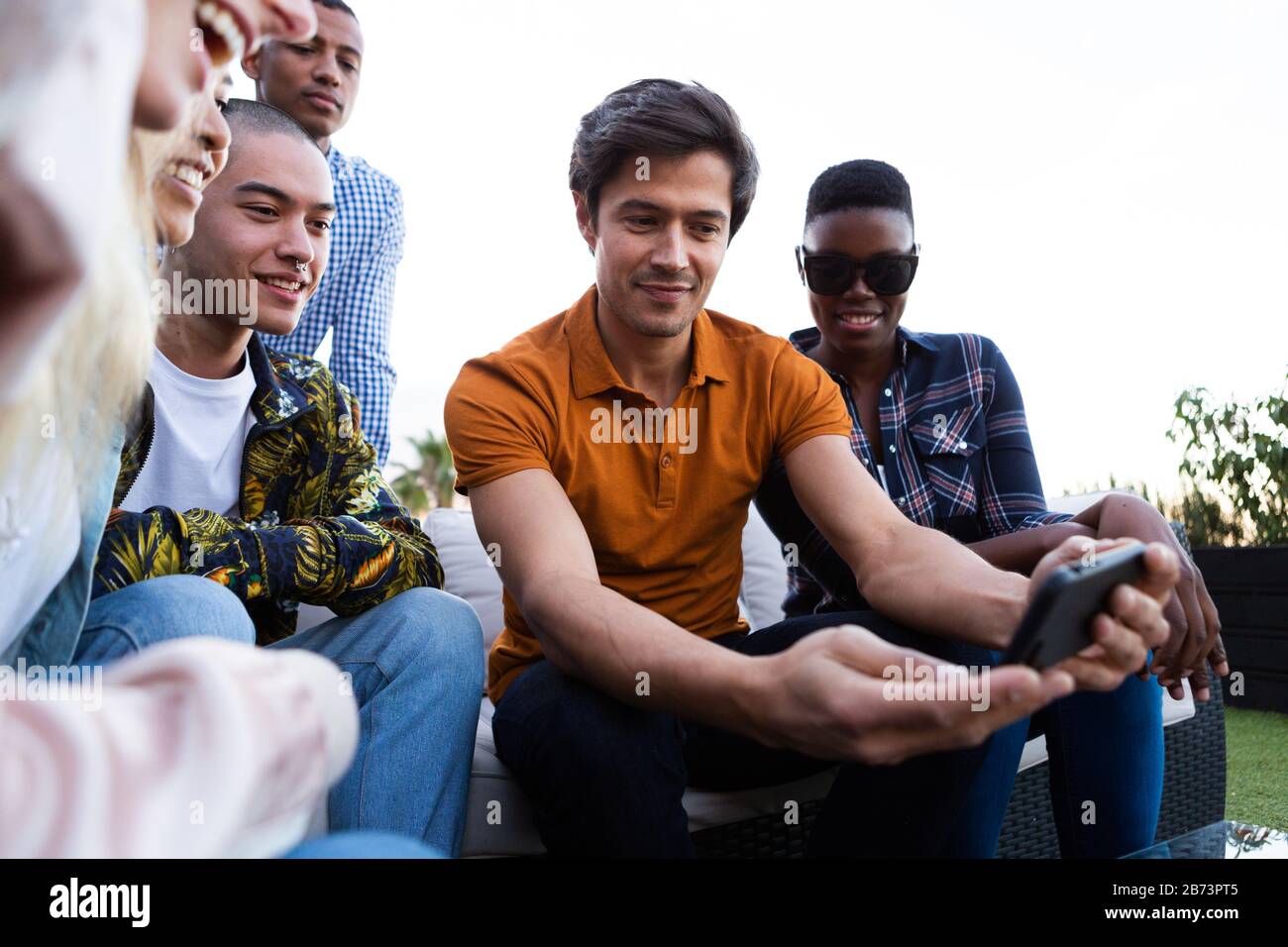 Group of mixed races friends together during a sunny day Stock Photo ...