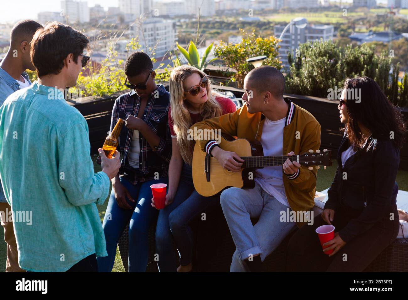 Group of mixed races friends together during a sunny day Stock Photo ...