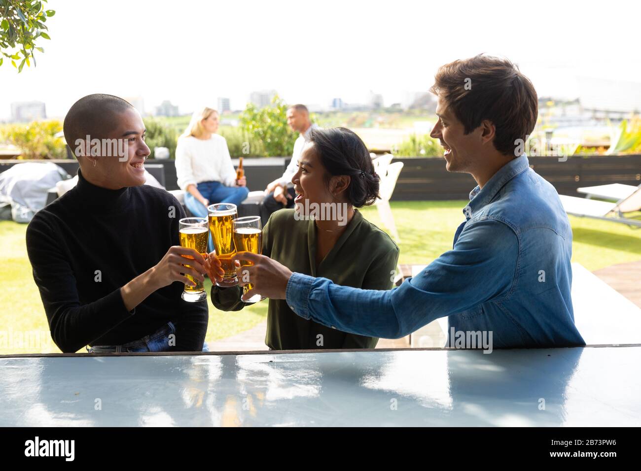 Group of mixed races friends together during a sunny day Stock Photo ...