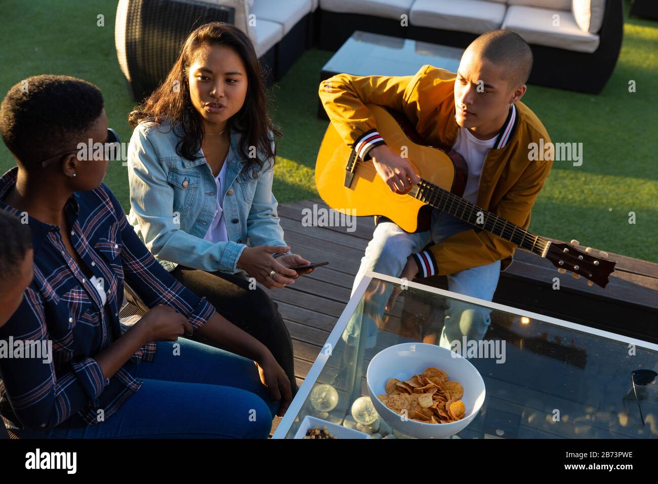 Group of mixed races friends together during a sunny day Stock Photo ...
