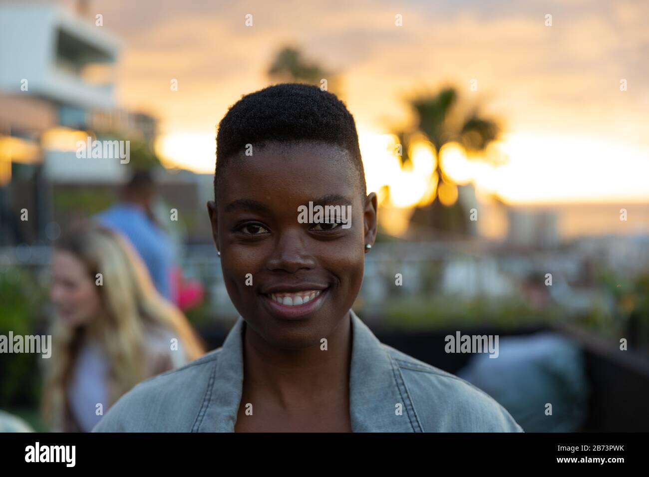 Woman on rooftop sunset hi-res stock photography and images - Alamy