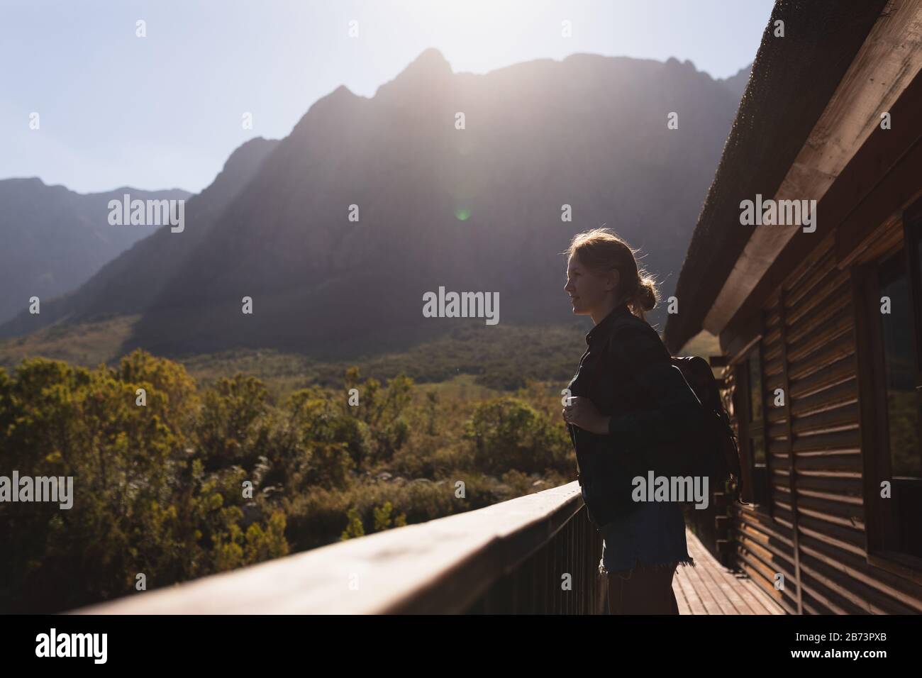 Back young woman standing balcony looking view hi-res stock photography ...
