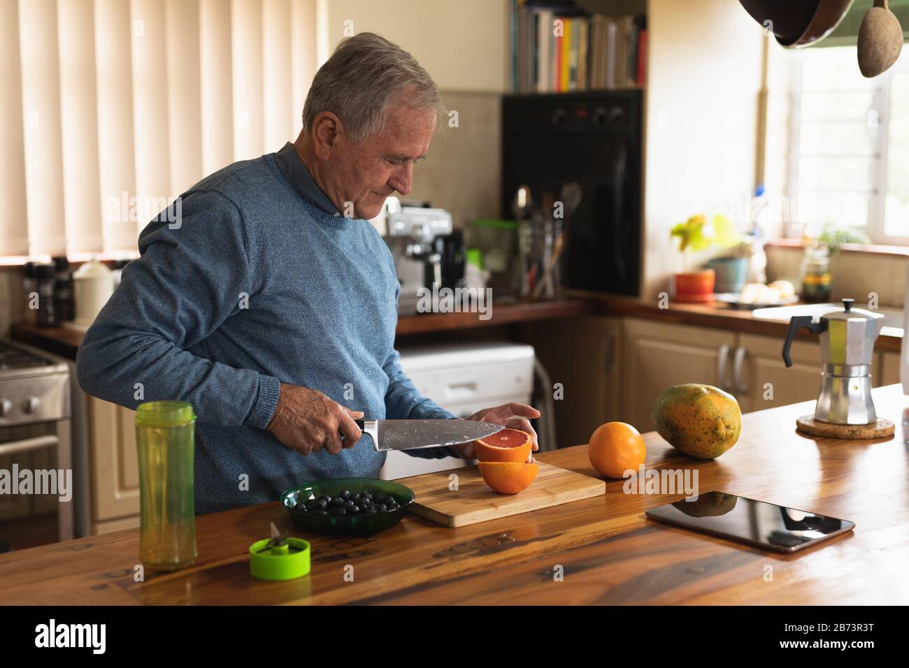 Elderly man cooking hi-res stock photography and images - Alamy