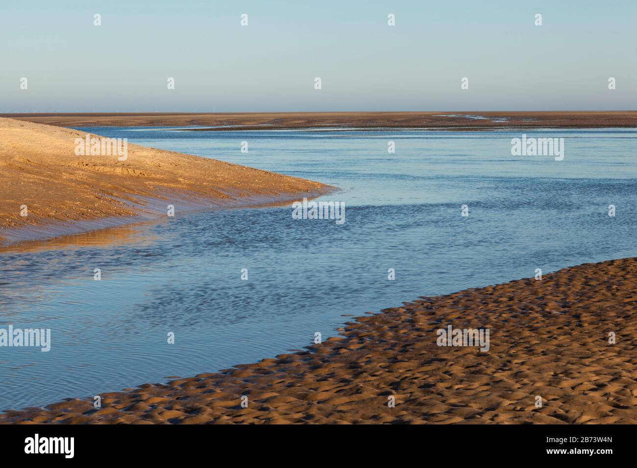 Low tide on a UK beach Stock Photo - Alamy