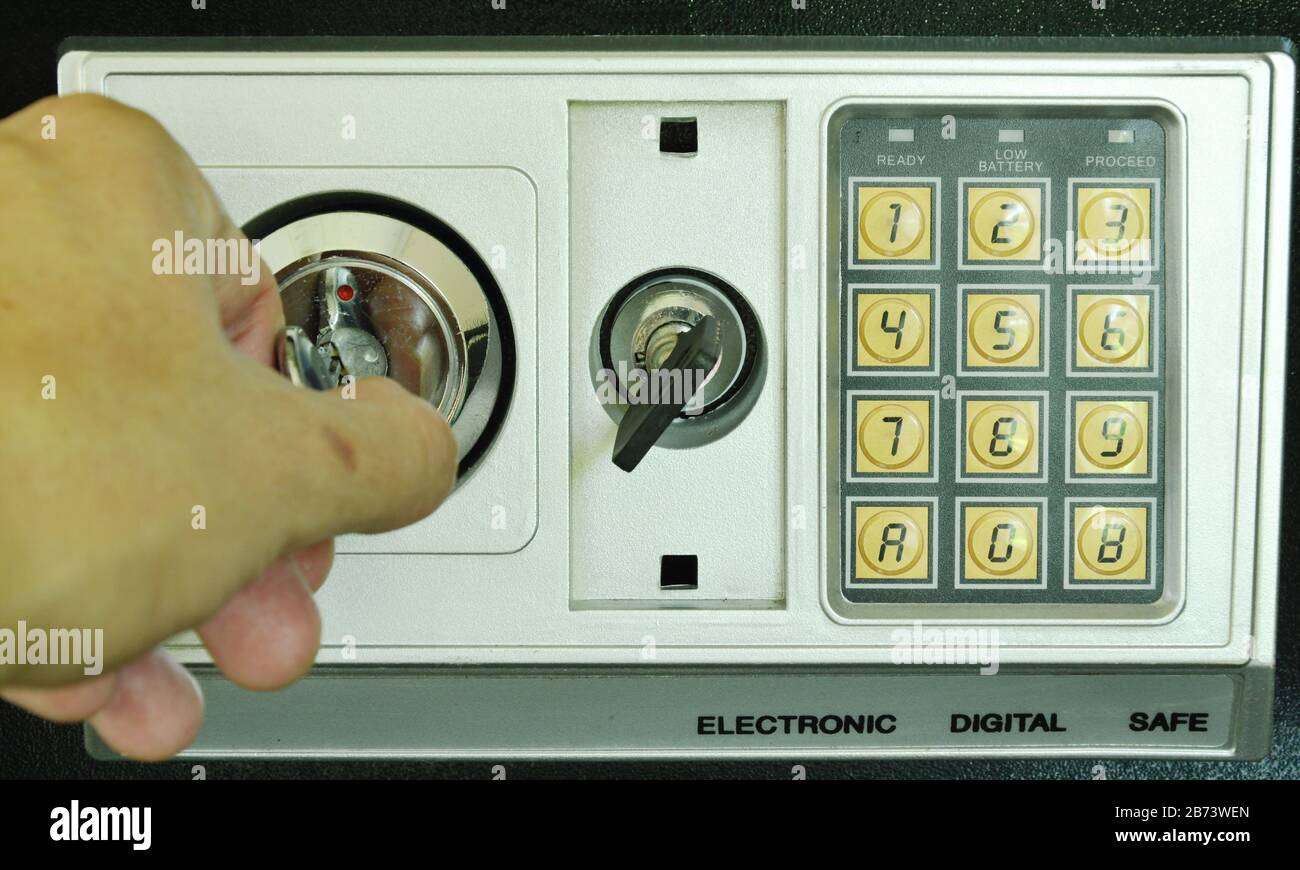 hand twist key to hole for open safe box with security electronic ...
