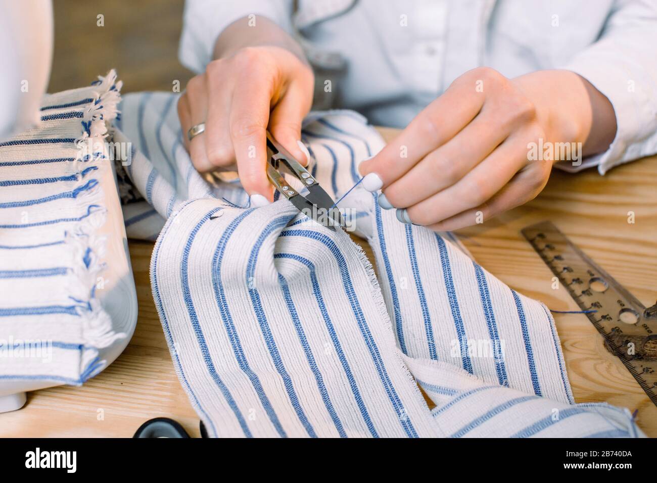 Tailor, dressmaker, fashion designer concept. Woman Hands working with ...