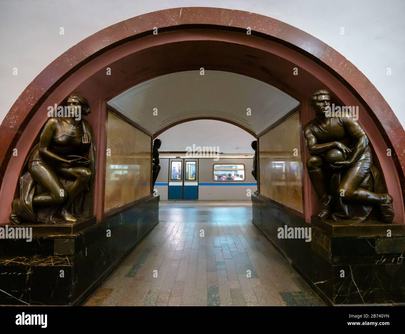 Sculptures on arch at Revolution Square or Ploshchad Metro station with ...