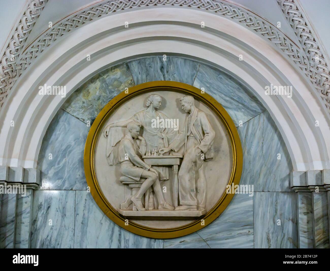 Close up of bas relief roundel depicting chess game, Park Kultury Metro ...