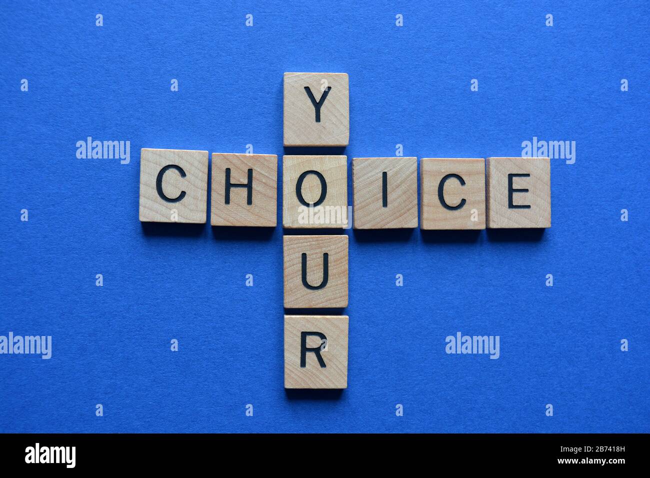 Your Choice, words in 3d wooden alphabet letters on blue background ...