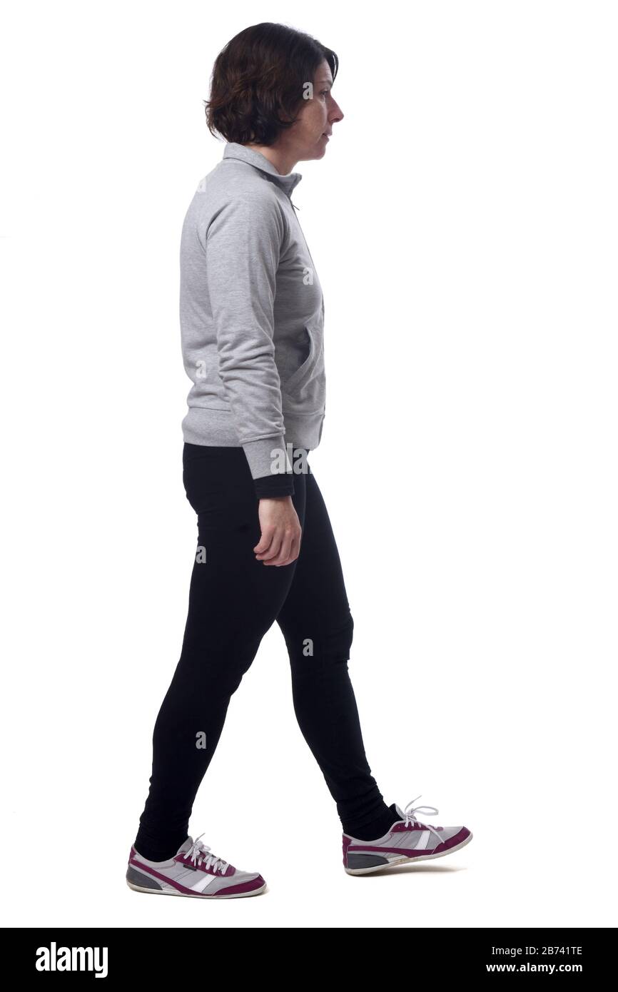 side view of a woman walking on white background Stock Photo - Alamy