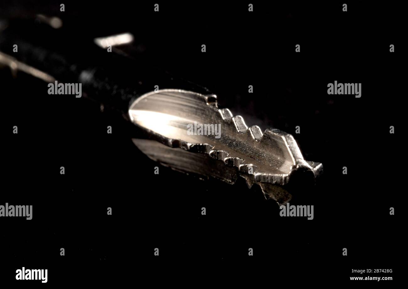 High security key closeup view on black background Stock Photo - Alamy